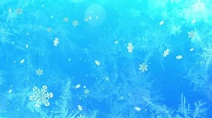 Snowflakes are falling on a blue background