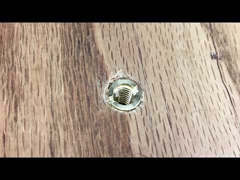 Installing threaded inserts into a wood table top.
