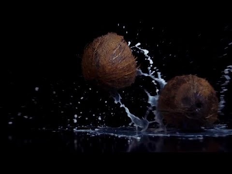 Coconut Broken In Slow Motion On Black BG Stock Video
