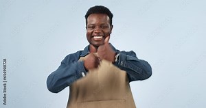 Waiter man, thumbs up and smile in studio, face or excited for good service review by blue background. African server, small business owner or barista with icon, emoji or dance with feedback for cafe
