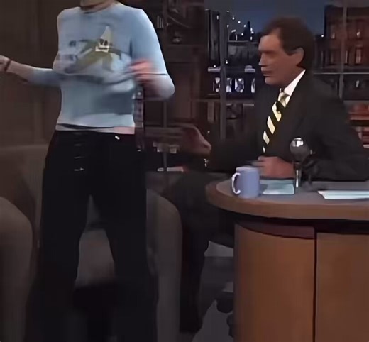 Drew Barrymore dances on David Letterman's desk on Late Show with David Letterman (1995).