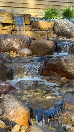 Just Add Water on Instagram: "Twisting and turning, but hitting all the right angles 🤩 #iowa #waterfall #justaddwateria #pond #outdoordesign"