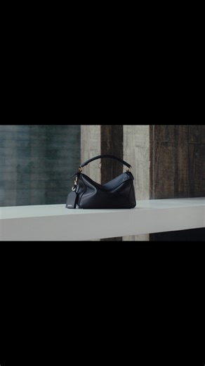 Crafted in smooth nappa leather, the Featherlight Puzzle is a lighter, slouchier iteration of Loewe’s iconic cuboid Puzzle bags. With a subtle shine accentuating its precise construction and distinctive silhouette, the Featherlight Puzzle fuses signature geometric design with contemporary elements, supple leather, metallic hardware, and heritage details. Shop Loewe at Level 1, The Mall | NUSTAR Cebu. #Loewe #LuxuryFashion #NUSTARCebu #TheMallNUSTARCebu #ShopWithTheStar | The Mall-NUSTAR Cebu