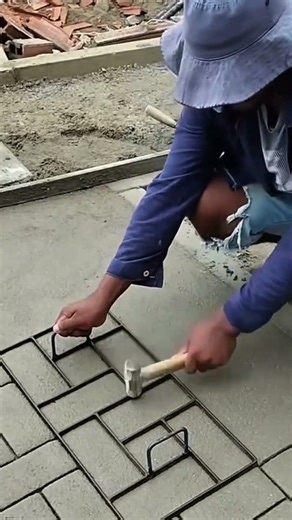 Using a cement mixture mold to neatly cast paving stones with cement mixture #construction #shorts