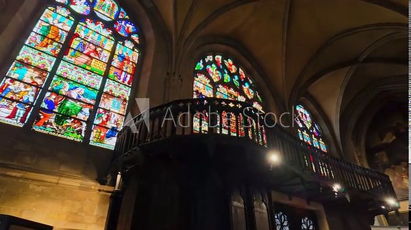 Stained glass windows interior and vaulted ceiling of Saint Julian Gothic Cathedral, Le Mans in France. Low angle