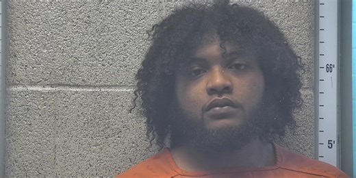 Man arrested after crashing into gas station sign, police say