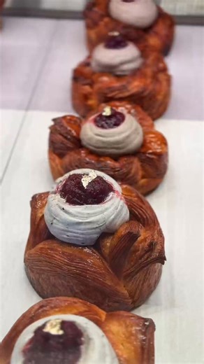Take a peek behind the scenes at the making of our Black Sesame & Cherry Tulip. 🍒🌷🥐 Our gorgeous tulip croissant filled with cherry jam and black sesame basque cheesecake, topped with black sesame vanilla chantilly cream and cherry compote. 😍 Pre-order available now. https://bit.ly/DromCinch ❤️ | DRÖM Bakery