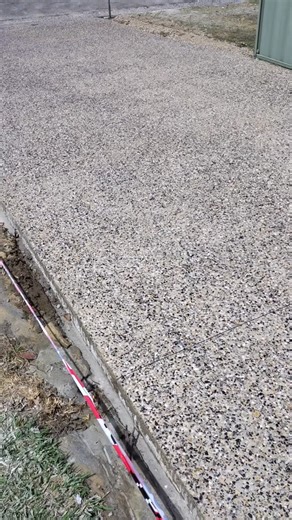 This exposed aggregate driveway is a full-on head-turner. Clean lines. Premium finish. Zero shortcuts. If your driveway isn’t stopping traffic, it’s time for an upgrade. 📩 DM us to book your free quote #boralconcrete #exposeddriveway | TLC Landscape & Concrete Design