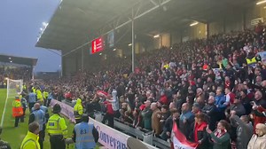 This was the moment thousands of fans ran onto the Racecourse pitch to celebrate Wrexham securing promotion to the Football League. https://www.itv.com/news/wales/2023-04-22/wrexham-promotion-game | ITV Wales