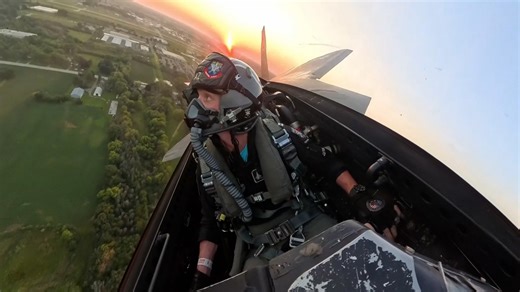 Inside the F-22 cockpit as vapor forms over the wings
