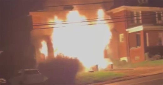 Video appears to show suspect standing outside home before fire