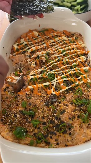 It was Fish Friday and we had salmon and surimi sushi bake. It was so good #sushibake #fishfriday #easyrecipes #explore #whatsfordinner Ingredients 245g crab sticks or surimi Large salmon fillet 1 block of cream cheese 1/3 cup kewpie mayo 2tbsp siracha 3 cups of cooked rice Furikake seasoning Tbsp mirin Tosp rice wine vinegar Spicy mayo Sriracha mayo Green onion Avocado Cucumber Method 1. Start with cooking your rice. 1 cup of uncooked rice will make 3 cups of cooked rice 2. Season your salmon f