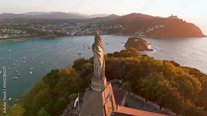 Sunset view over the statue of Christ in San Sebastian town, Basque, Spain