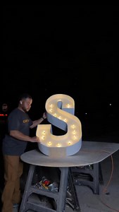 DIY Marquee letter S All done! It was nice to try out a different font for the marquees. Do you all like the varsity/block font or the script font better ? Tools used: Gear: @carhartt Sander: @uneedainc Sprayer: @wagnerspraytech Caulk: @dapproducts & @loweshomeimprovement You can find most of these items in my Lowe’s store front, linked in my bio Also take 15% off your next Uneeda Sanding order with code LAW15. #marqueeletters #lowescreator #letterlights | Built By Law LLC