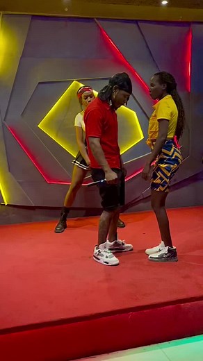 Energetic Dance Performance in Vibrant Geometric Room