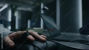 Close-up Shot of the Suspect's Hand Connected to the Lie Detector / Polygraph Test Machine, while Female Special Agent Conducts Questioning.