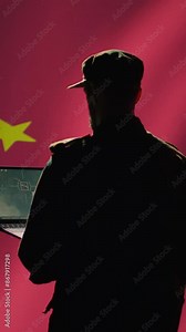 Vertical video Chinese soldier using radar detecting ballistic missile attacks and conducting general space surveillance and satellite tracking. CCP agent using military laptop software preventing