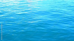 Perspective light gradient blue morning Japanese winter sea ocean surface background, small calm wave moving horizontally, bright sun reflection, view from ship sailing continuously