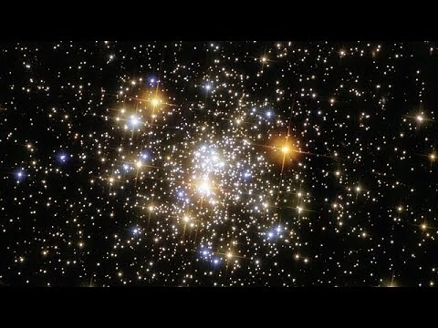 A Glittering Globular Cluster: Messier 15 | Hubble FriendsofNASA.org: This cluster of stars is known as Messier 15, and is located some 35,000 light-years away in the constellation of Pegasus (The Winged Horse). It is one of the oldest globular clusters known, with an age of around 12 billion years. Both very hot blue stars and cooler golden stars can be seen swarming together in the image, becoming more concentrated towards the cluster's bright center. Messier 15 is one of the densest globular