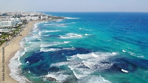 Drone view of blue sea water with waves and beaches in protaras with hotel resorts, Cyprus