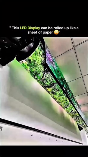 Knowledge Matrix on Instagram: "This LED display can be rolled up like a sheet of paper — flexible, lightweight, and futuristic. 🖥️✨ This video showcases an ultra-thin LED panel that bends, folds, and rolls without breaking, opening new possibilities for screens in advertising, architecture, and portable devices. Unlike traditional rigid displays, these use flexible circuits and micro-LEDs embedded in bendable substrates, maintaining brightness and resolution even when curved. The technology al