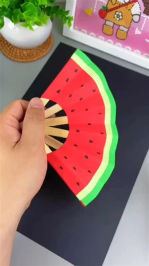 Magic.hands_creation on Instagram: "Watermelon Hand Fan 🍉 | Easy DIY Paper Craft Made this cute watermelon hand fan using paper and sticks 🍉 Perfect for summer vibes, kids crafts, and fun decoration. Simple, colorful, and refreshing to make! #WatermelonCraft #PaperFan #DIYCraft #SummerCraft #KidsCraft"