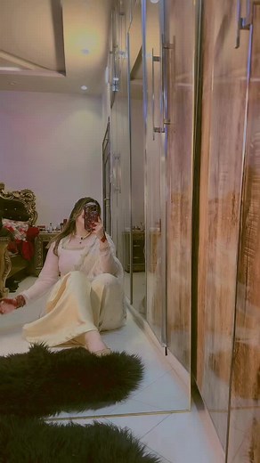 Traditional Attire Mirror Selfie in Luxurious Room