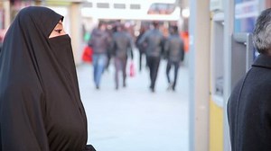 clip-6934060-steadicam---woman-headscarf-chador-using-atm