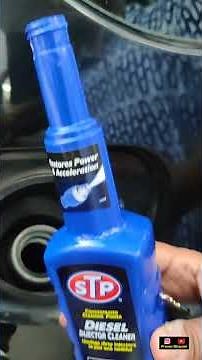 STP Diesel Injector Cleaner Concentrated additive being poured in my Toyota Fortuner's fuel tank