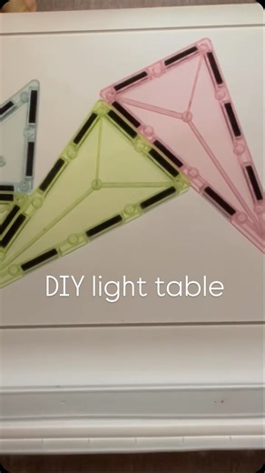 Megan⎢Learn to do More with Less on Instagram: "Using a light table is such a fun (often overlooked!) form of sensory play! 💡 Most of us don’t have the space or budget for a light table, but a flashlight and a bin will do the trick. Add some magnetic tiles or any other toys to experiment with light, shadows, and color. Follow for more easy sensory ideas using stuff you already have."