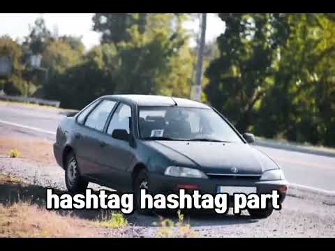 A car is a parked in a parking spot