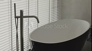 Modern bathtub with blinds and floormounted faucet adds elegance to bright space