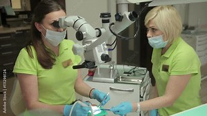 Dentist Exam With Microscope