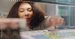 Woman, counting and inventory or working in retail, small business and employee for stocktake in commerce industry. Product, checking and goods for checklist in store, lights and shelf for item