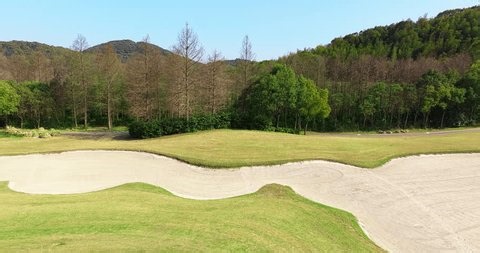 clip-3987451951-scenic-golf-course-landscape-large-sand-bunker