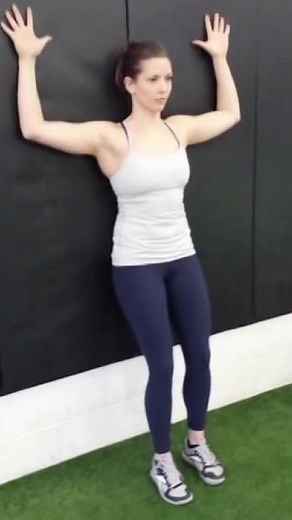 Wall slides for scapular stability