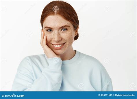 Women Beauty Tender And Feminine Redhead Girl Smiling White Teeth Touching Pale Facial Skin