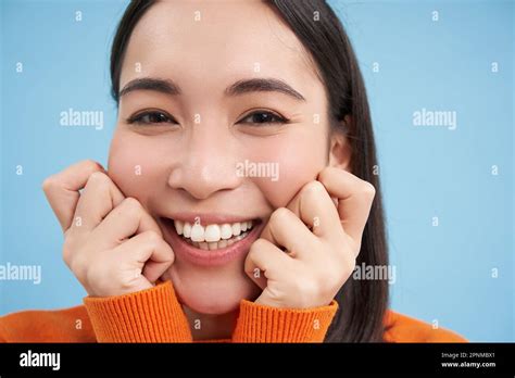 Close Up Portrait Of Beautiful Japanese Brunette Girl Smiling And Looking Lovely At Camera