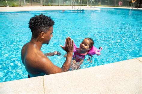 Premium Photo Father And Daughter Having Fun In Pool
