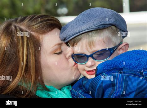 Mother Kissing Son Stock Photo Alamy