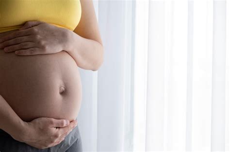 Premium Photo Woman Touching With Hands Her Naked Pregnant Belly Baby