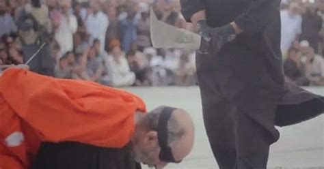 Sickening Footage Shows Isis Executioners Beheading Two Men Accused Of Being Sorcerers In