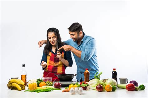 Premium Photo Indian Couple In Kitchen Young Beautiful Asian Wife Enjoying Cooking With