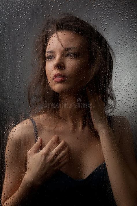 Portrait Of A Beautiful Girl Behind Wet Glass Stock Image Image Of