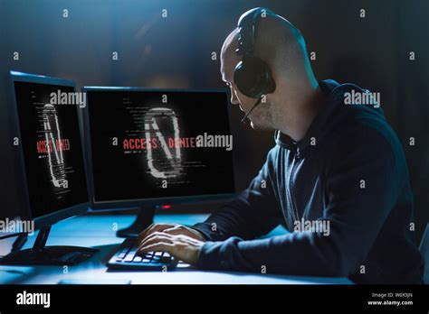 Hacker With Access Denied Messages On Computers Stock Photo Alamy
