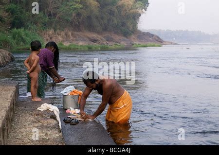 Indian Mother Washing Her Son In An Village Fountain Orchha Madhya