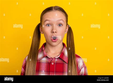 Photo Of Impressed Cute Schoolgirl Wear Checkered Shirt Big Eyes Open Mouth Isolated Yellow
