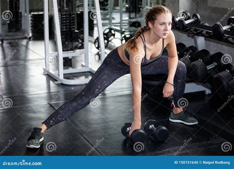 Young Fitness Girl Doing Exercise Squat With Dumbbell In Gymwoman In Sportswear Workout
