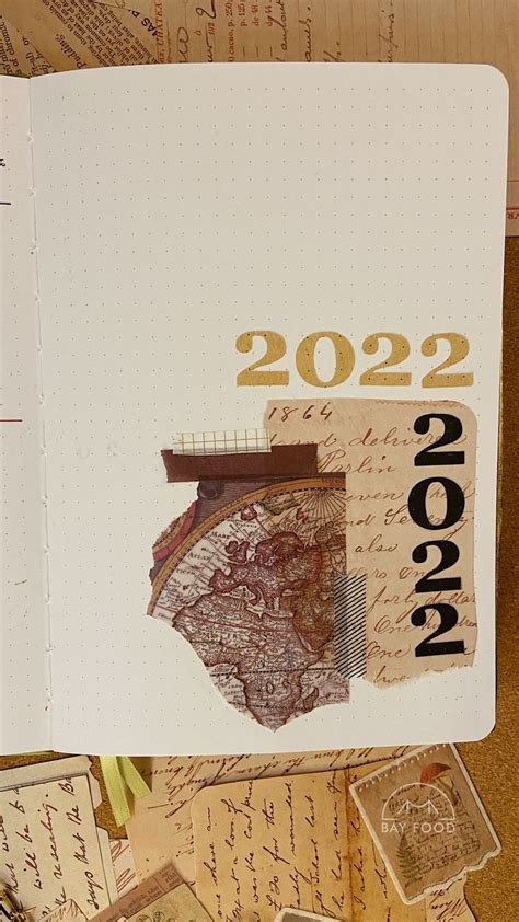 An Open Notebook With The Word 2012 Written On It Surrounded By Old