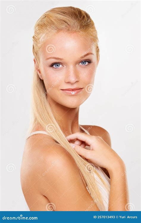 Shes Not Your Average Girl Next Doora Beautiful Blonde Woman Playing With Her Hair And